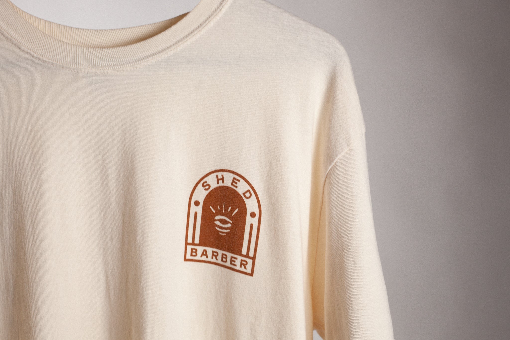 Ivory Neighborhood Tee – SHED Barber and Supply